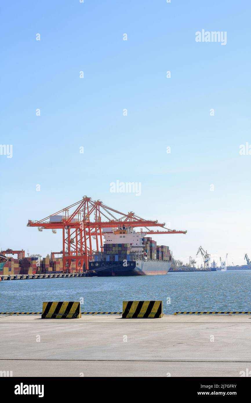 Container ship being loaded in the port of Gdynia in Poland Stock Photo ...