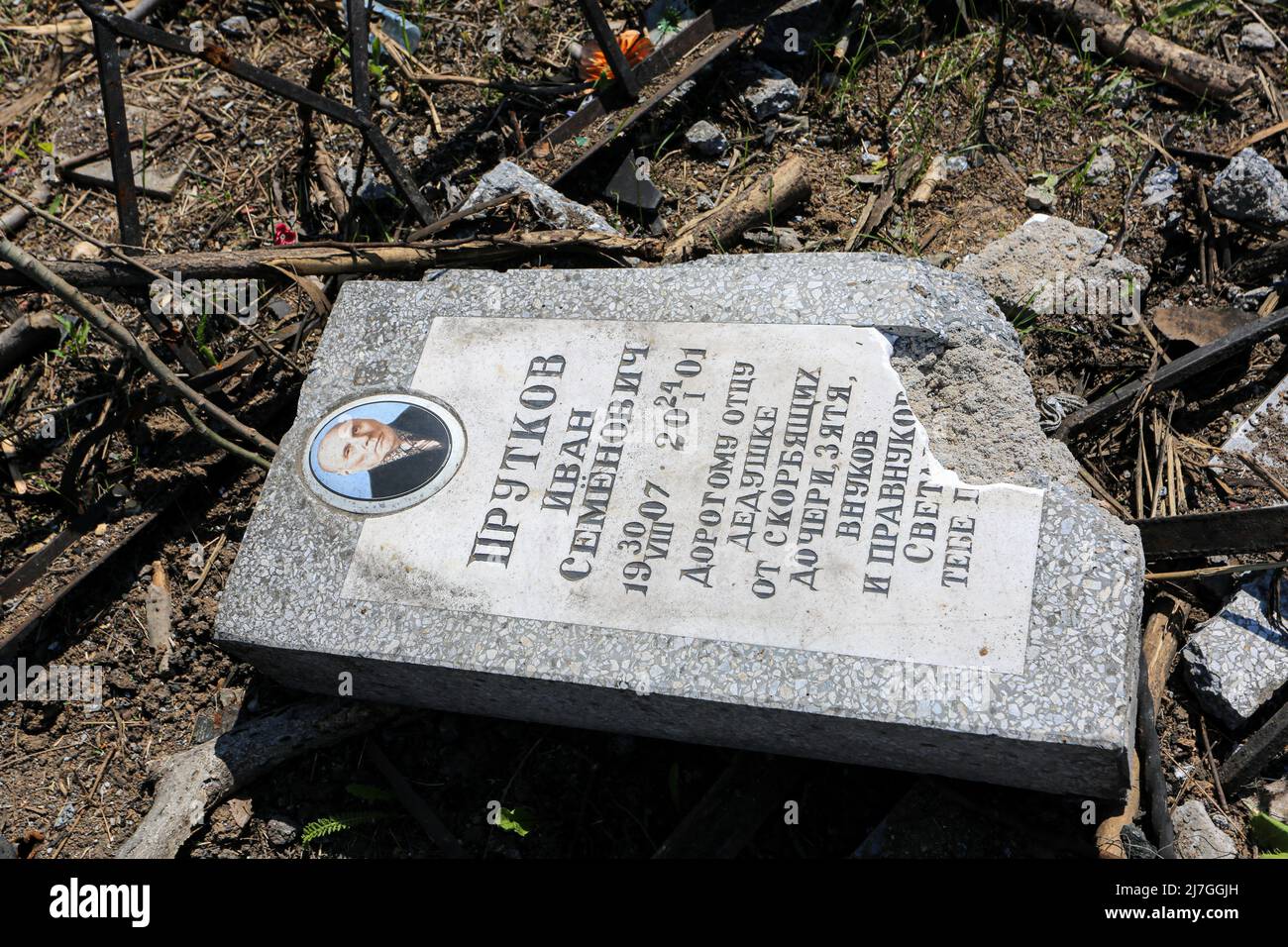 A destroyed gravestone during the Russia-Ukraine war. Russian shelling ...