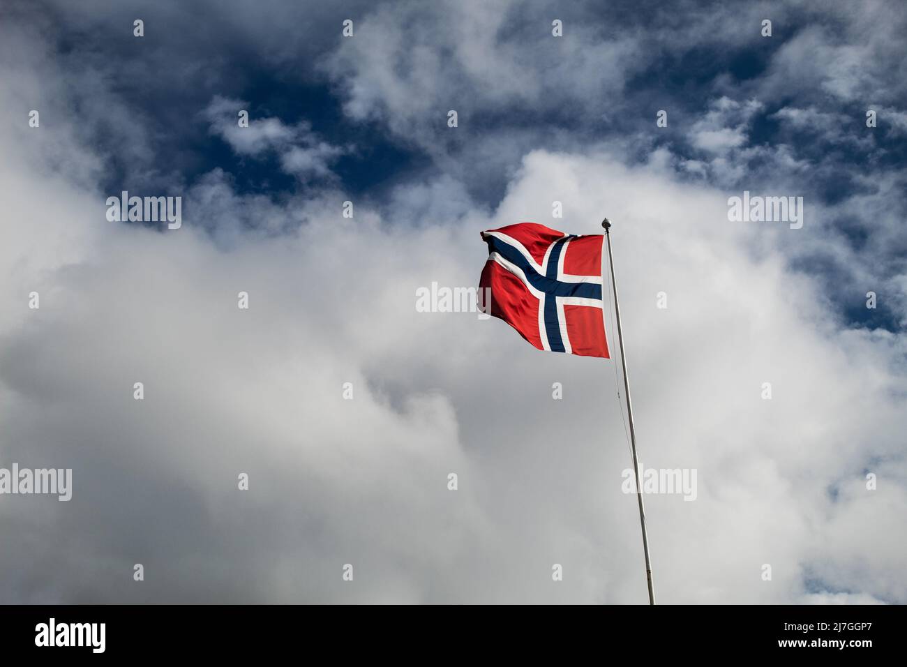 Norwegian flag flying on sky background Stock Photo - Alamy