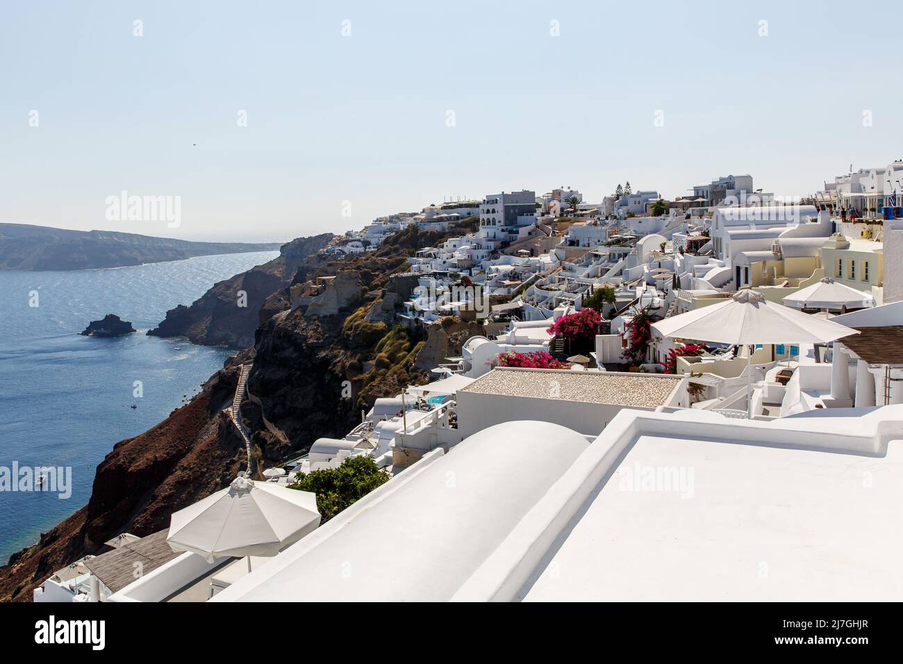 Traditional greek white houses on Santorini coast near the Aegean Sea ...