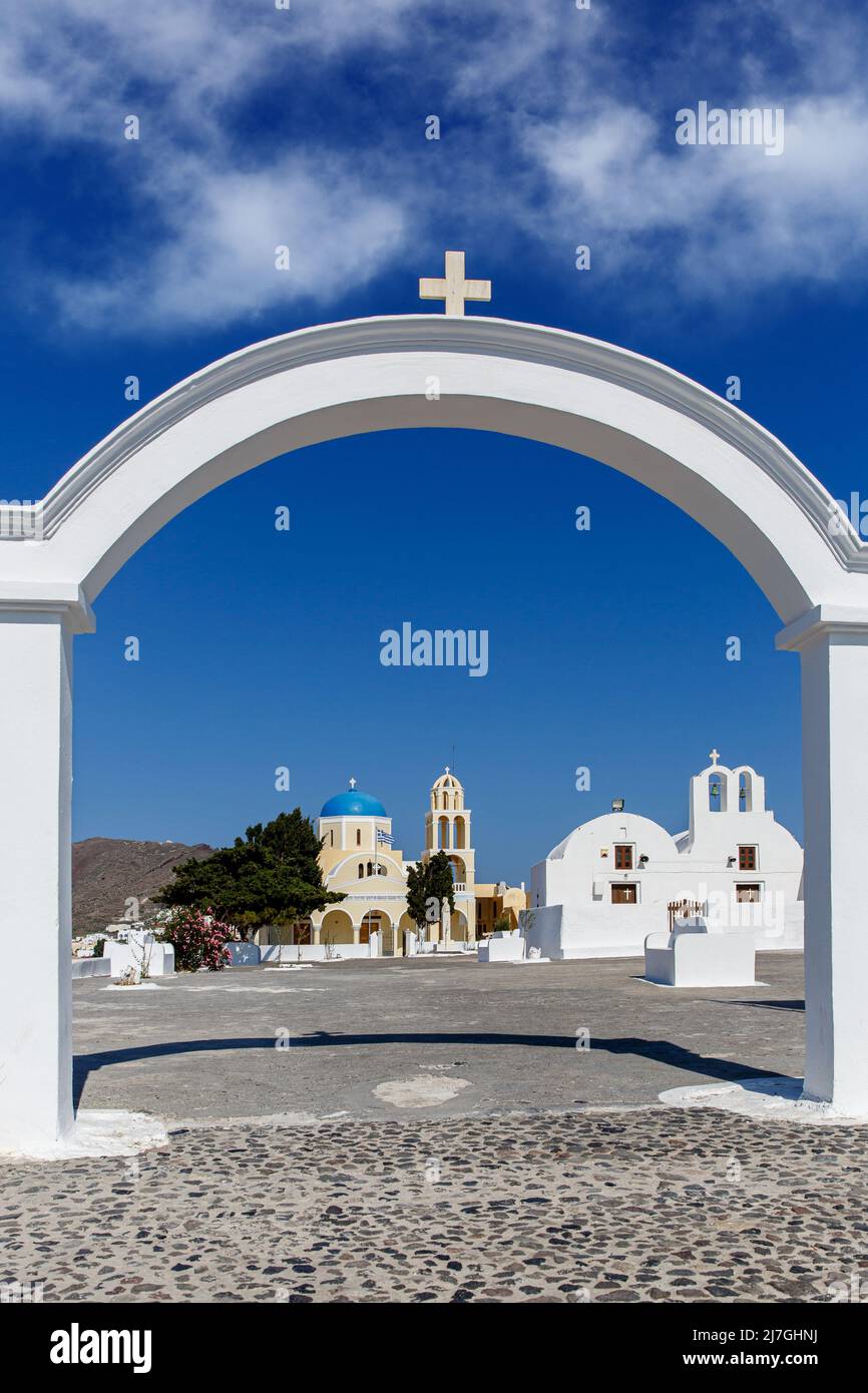 White arch with a cross under the blue sky. Greek church in the ...