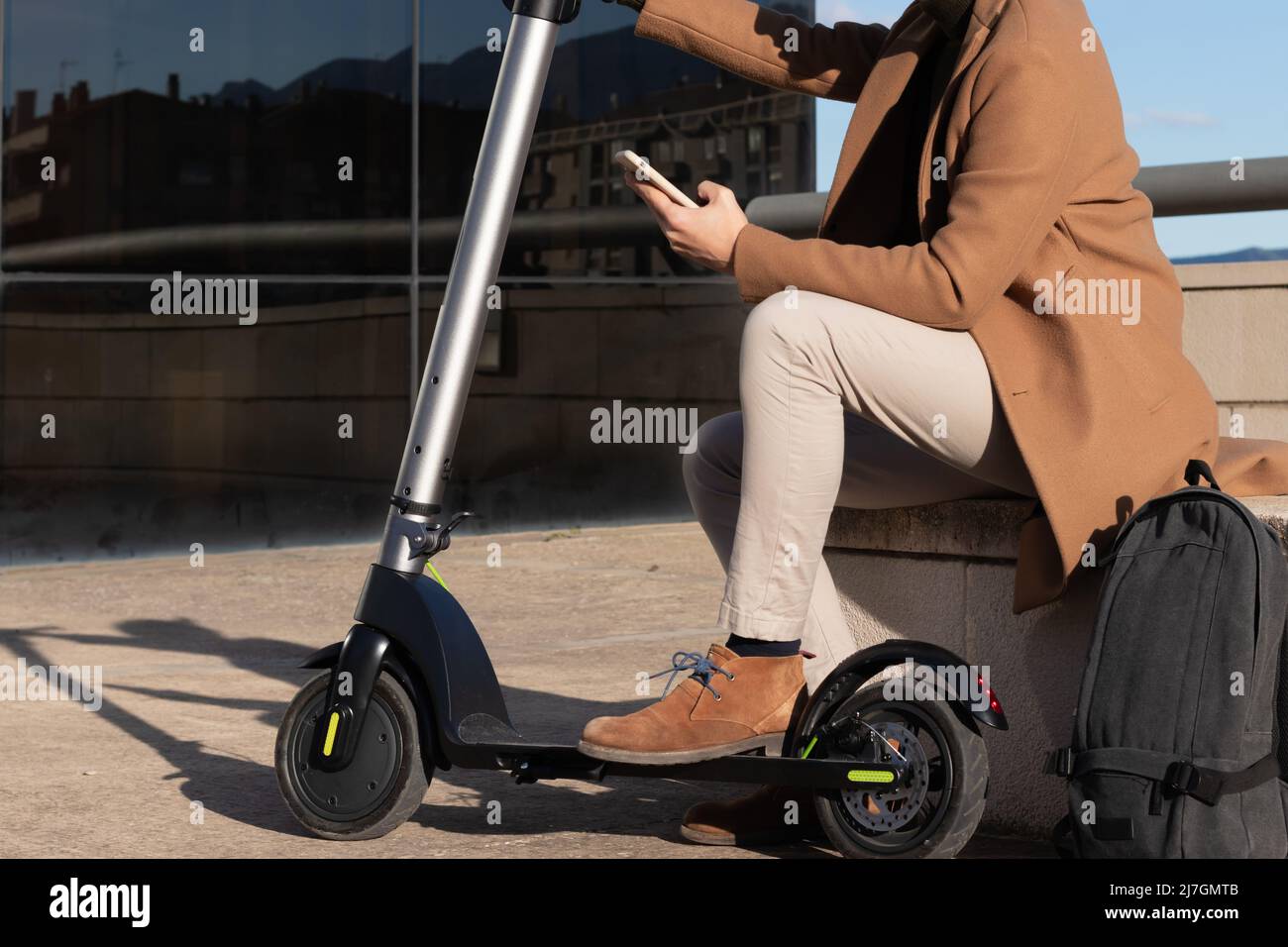 Electric scooter rent with mobile phone. Man using smartphone rental ... Electric scooter rent with mobile phone. Man using smartphone rental ...