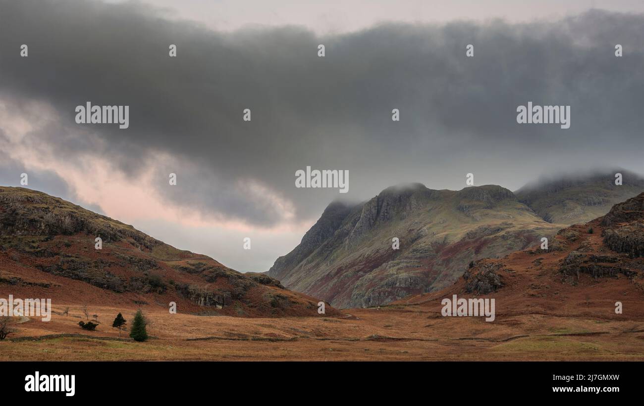 Epic landscape of sunrise light over Blea Tarn in Lake District with ...