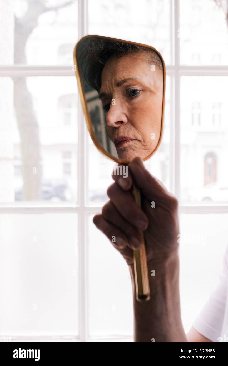 Sad woman with body image mirror hi-res stock photography and images ...