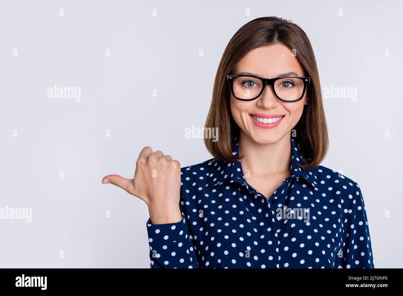 Photo of young pretty woman indicate thumb empty space ads decision ...