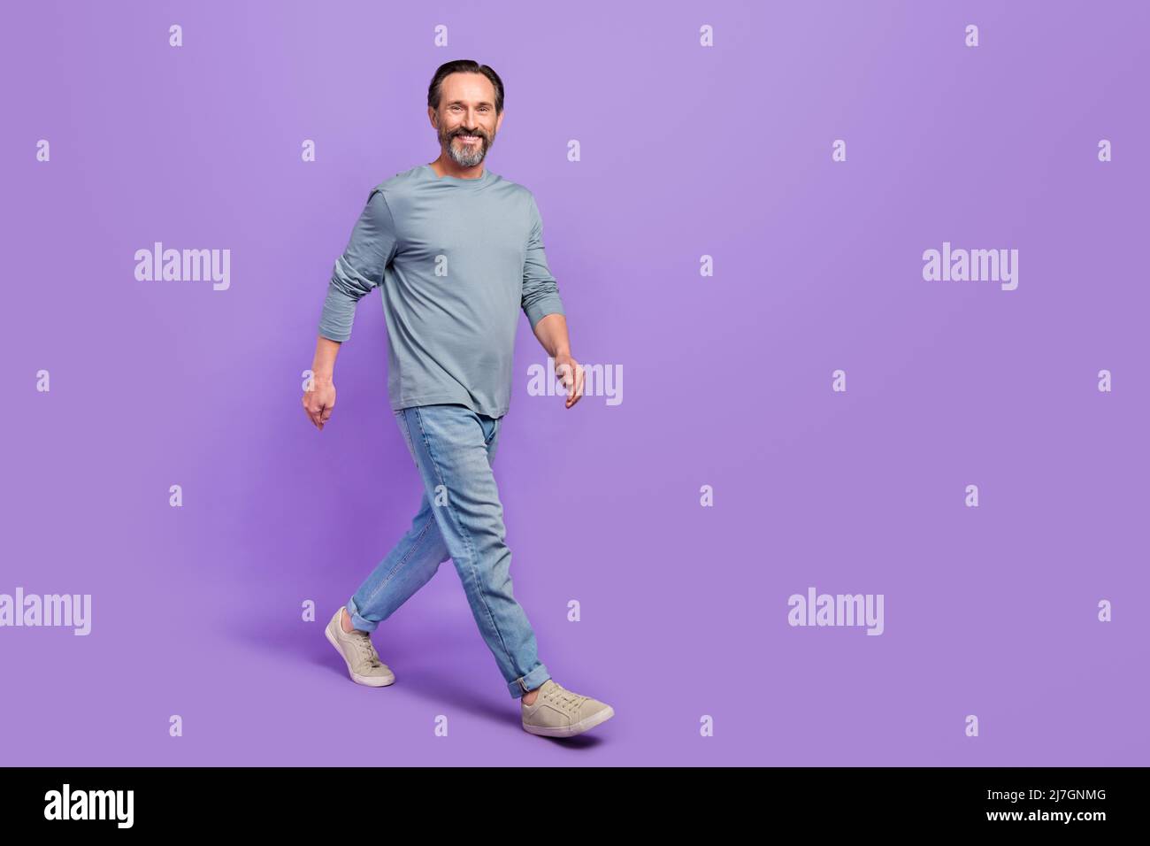 Full body profile photo of cheerful friendly person walk look camera ...