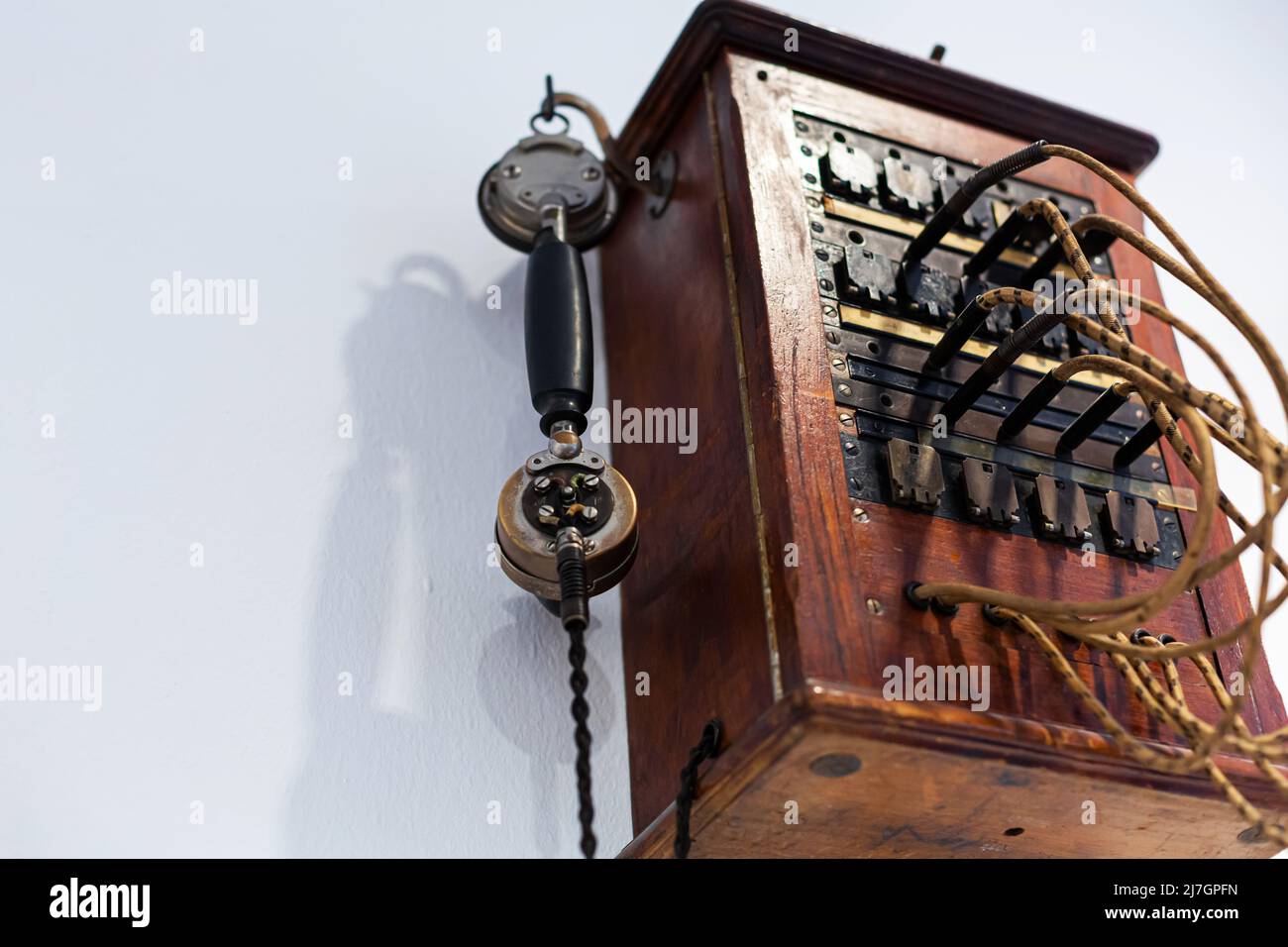 Details of the antique telephone set made of wood Stock Photo - Alamy