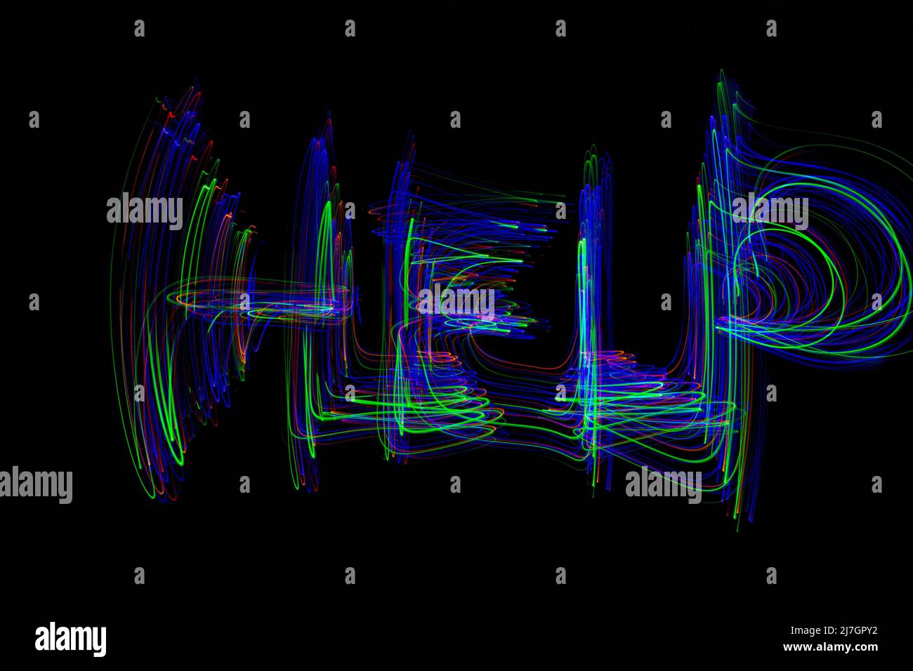 The word 'Help' written in the air with bright neon coloured motion ...