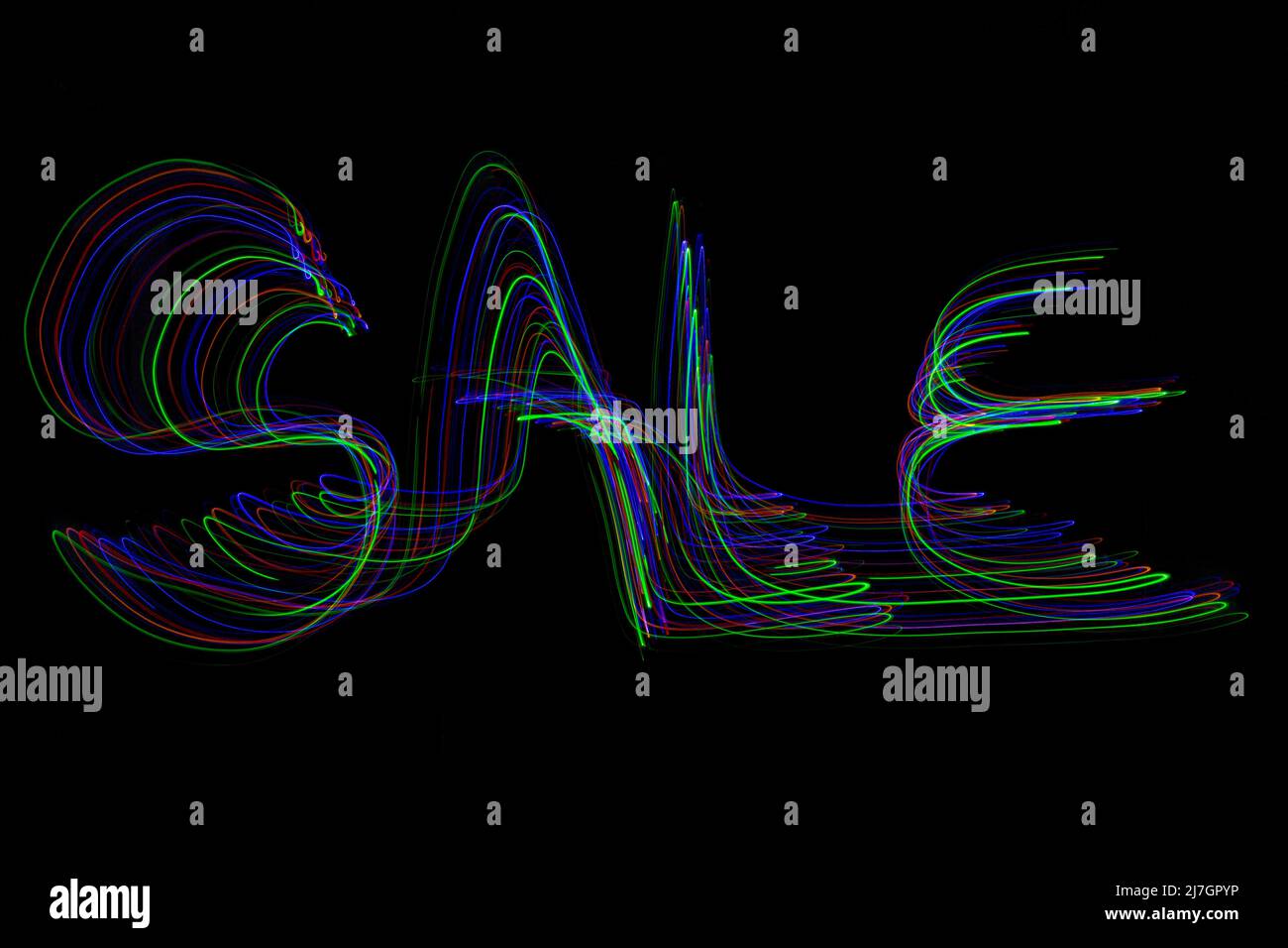 The word 'Sale' written in the air with bright neon coloured motion ...