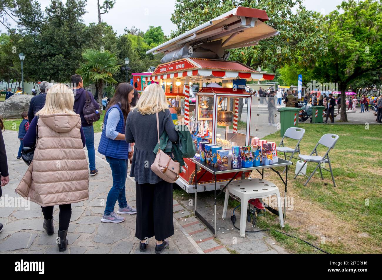 People ordering in the popcorn stand on the Dinosaur Festival in ...