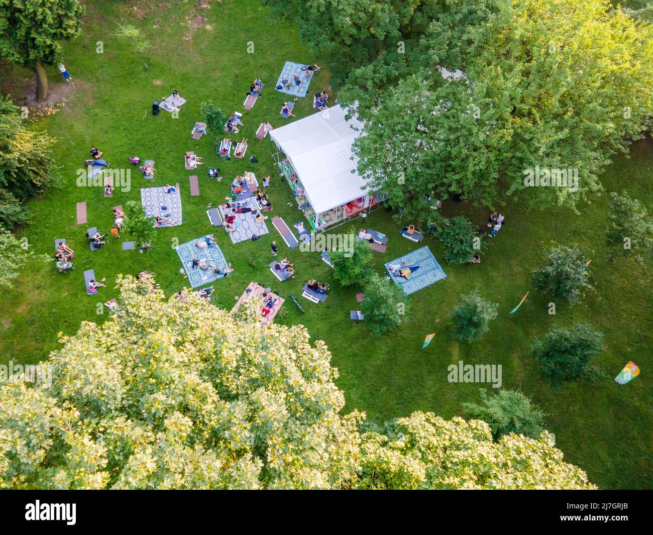 people laying down at city public park overhead top view outside ...