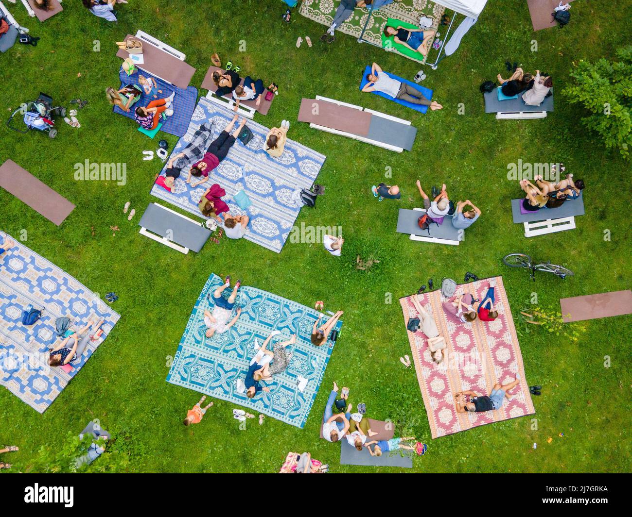 people laying down at city public park overhead top view outside ...