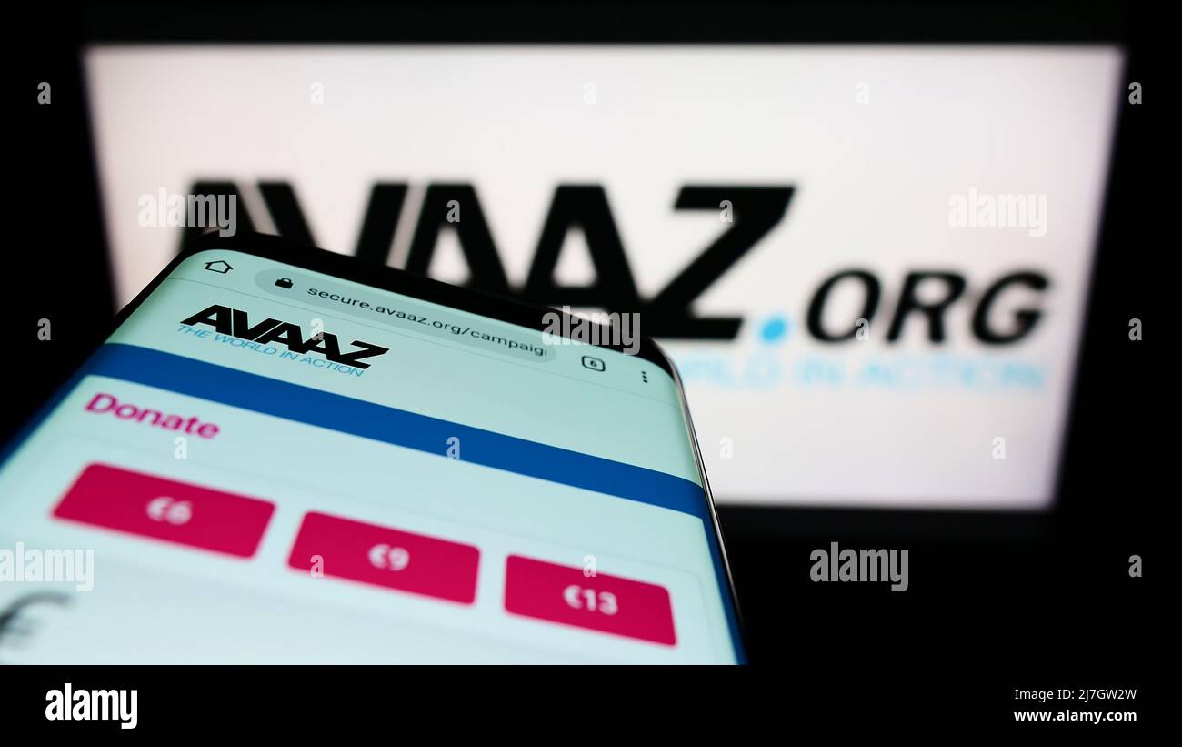 Person holding smartphone with webpage of US nonprofit organization ...