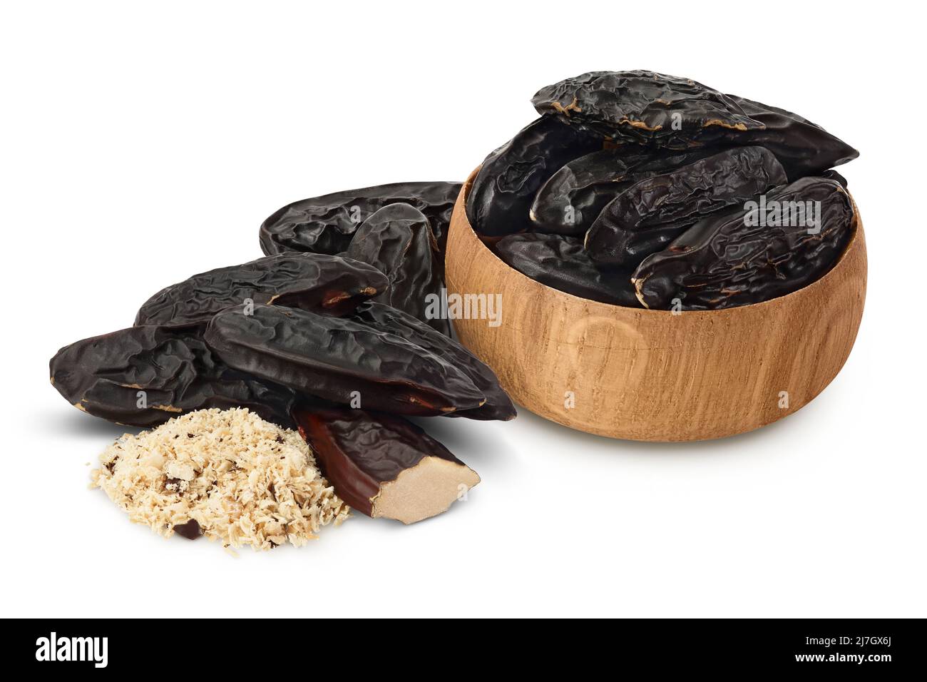 Tonka bean in wooden bowl isolated on white background with clipping ...