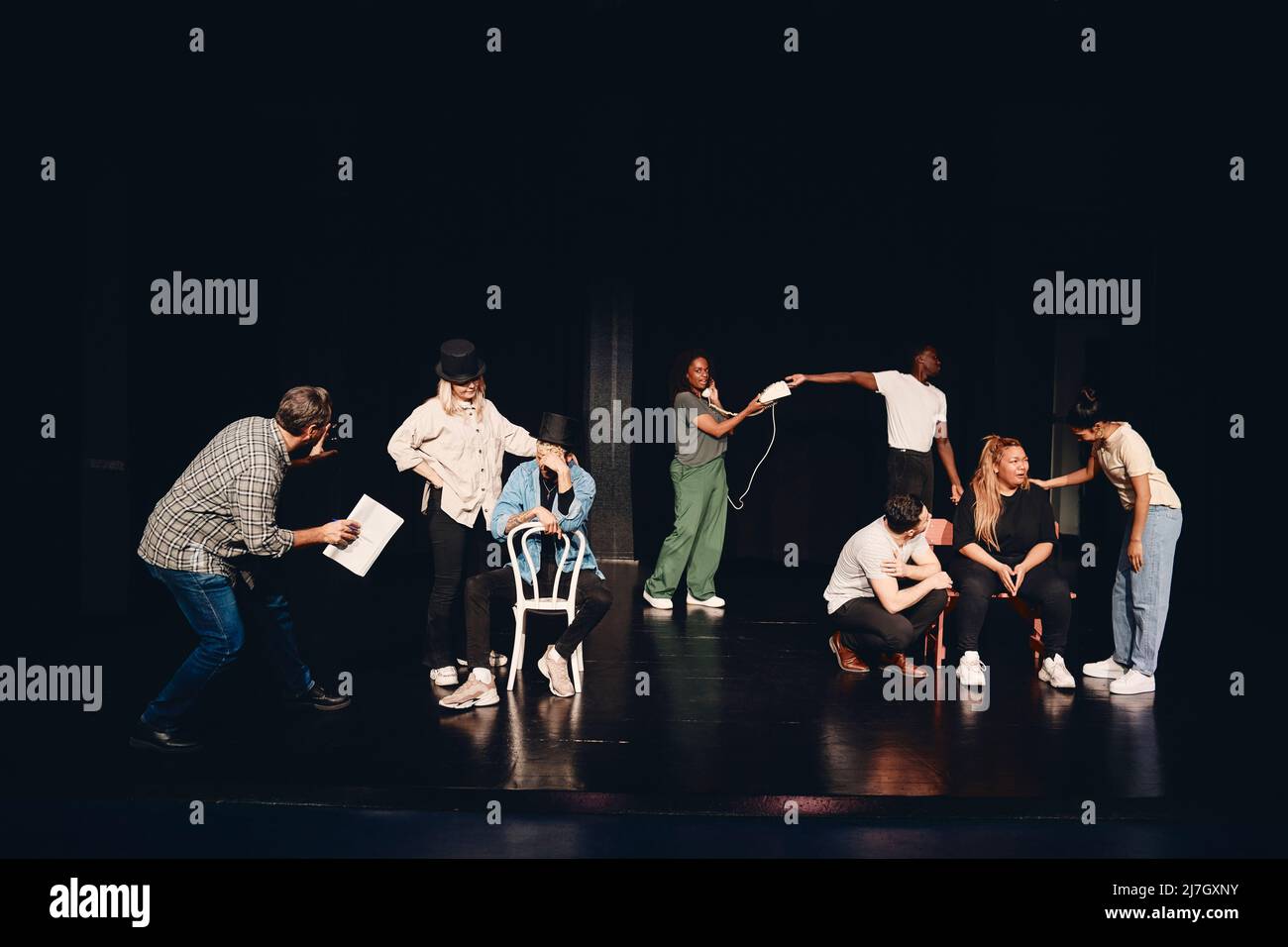 Stage performers practicing act together on stage in class Stock Photo ...