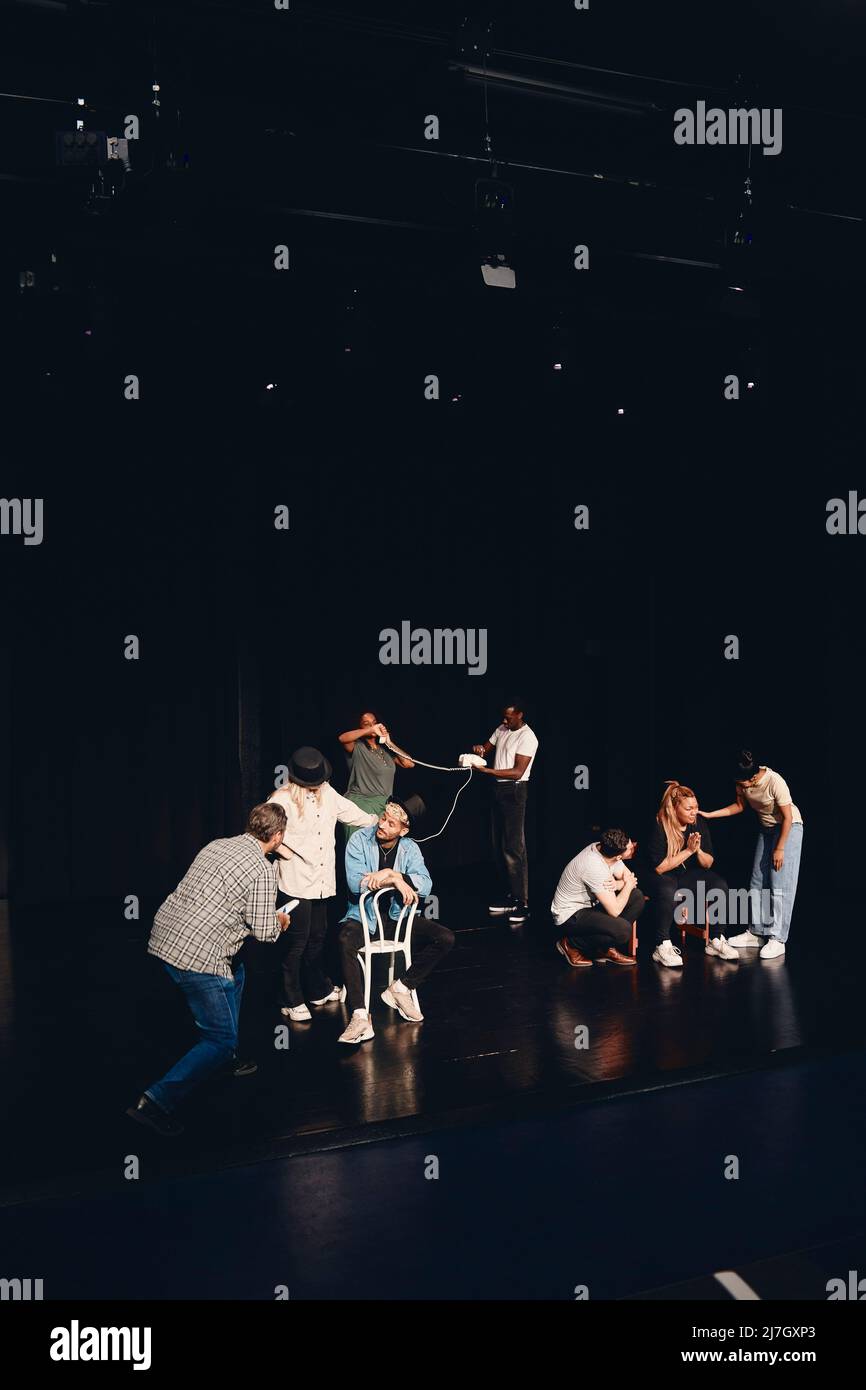 Actors and actresses rehearsing together on stage Stock Photo - Alamy