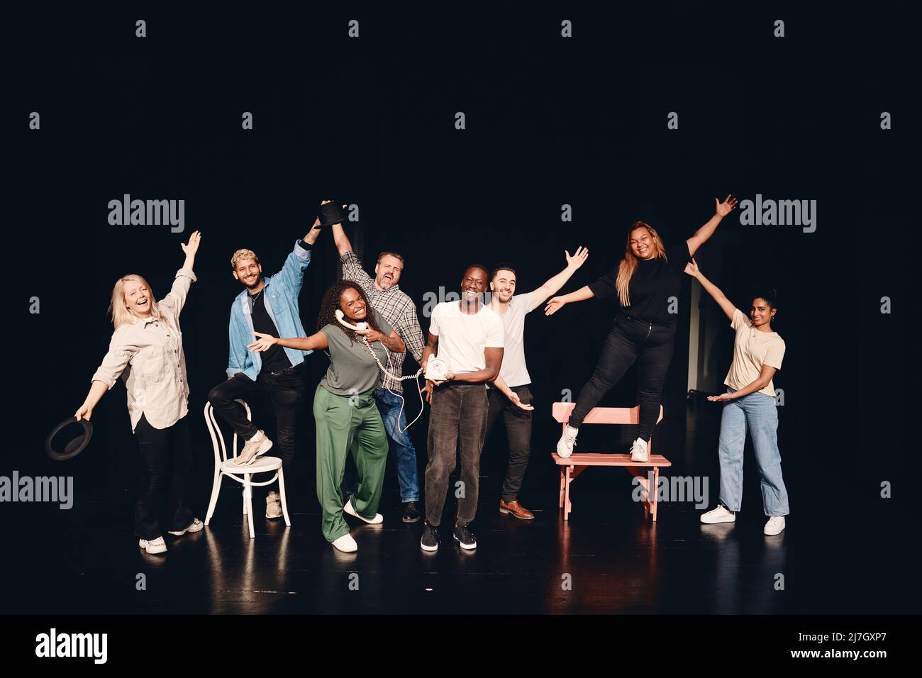 Full length portrait of happy artists together on stage Stock Photo - Alamy