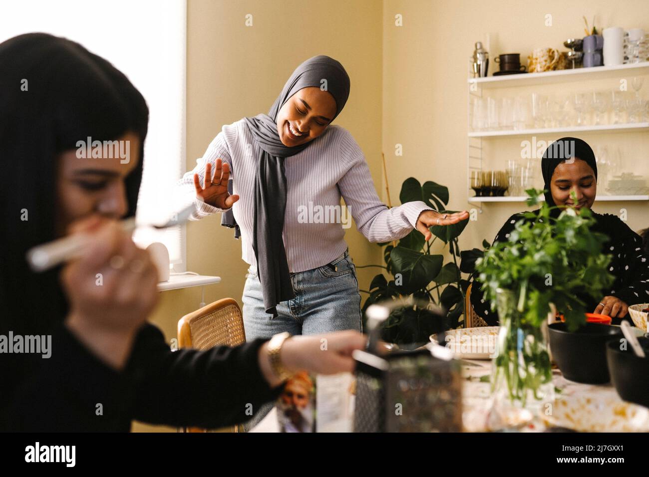 Three friends cooking kitchen hi-res stock photography and images - Alamy