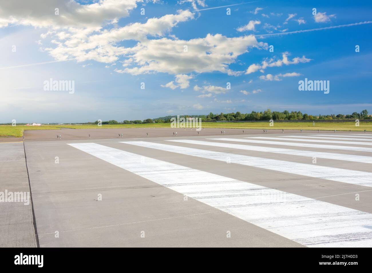 Empty Runway, airstrip in the airport with marking on blue sky with ...