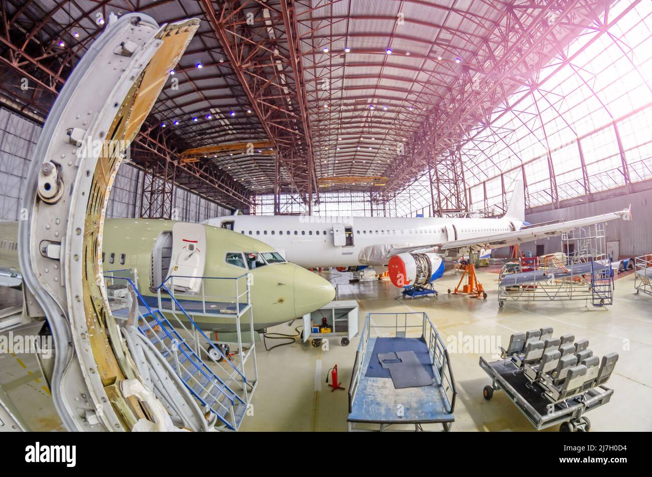 View from the aircraft with the door open to the aircraft hangar and ...