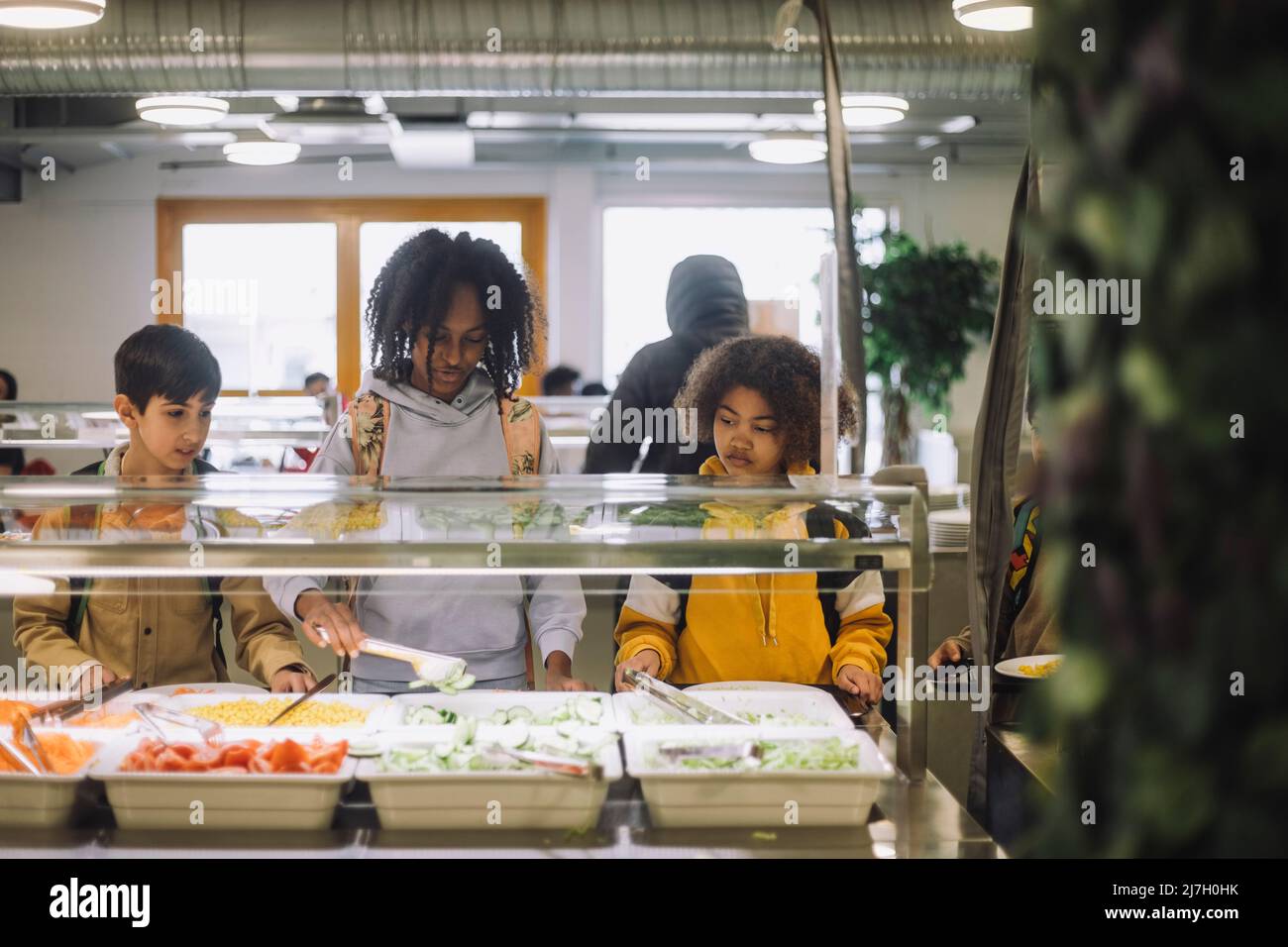 Middle school cafeteria boys hi-res stock photography and images - Alamy