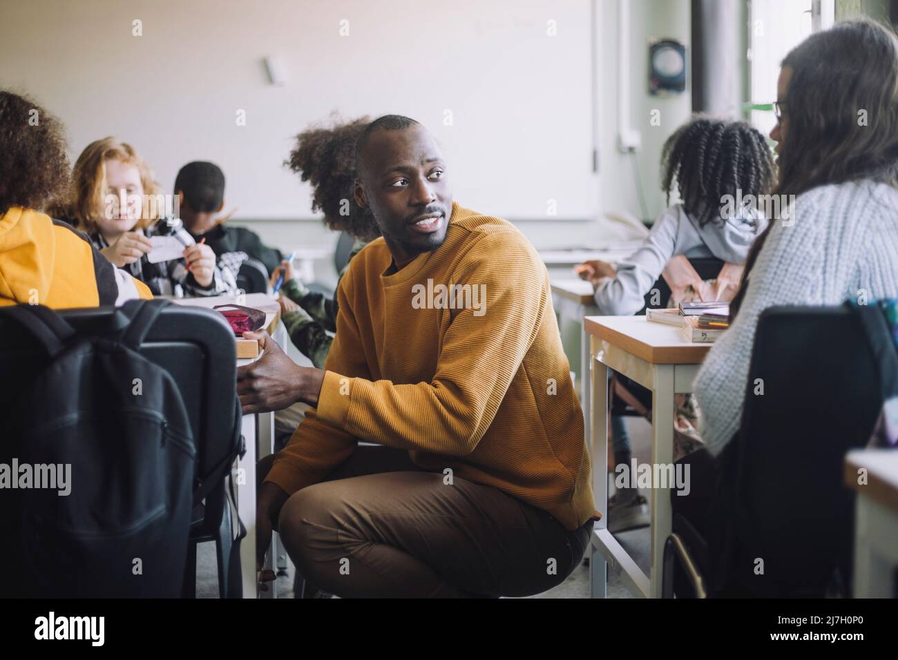 Man Teacher Talking To Student