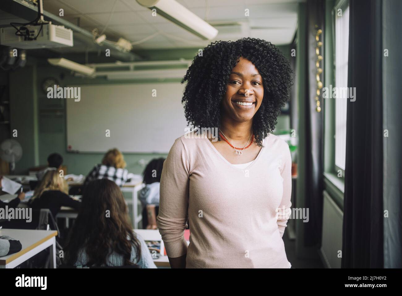 Smiling teacher hi-res stock photography and images - Alamy
