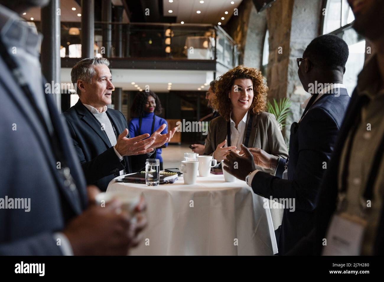Group businessmen woman talking meeting hi-res stock photography and ...
