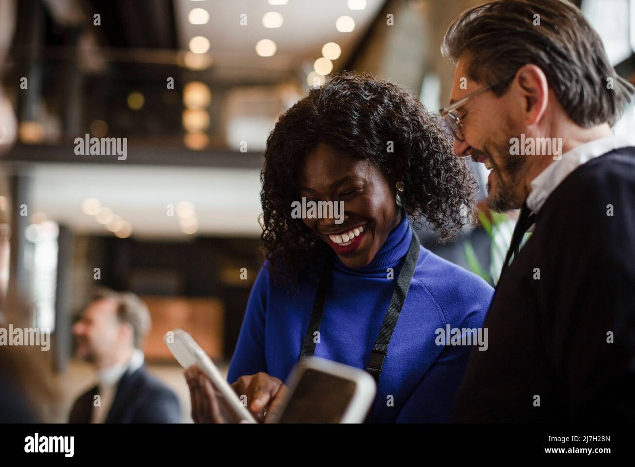 Group professionals smiling laughing hi-res stock photography and ...