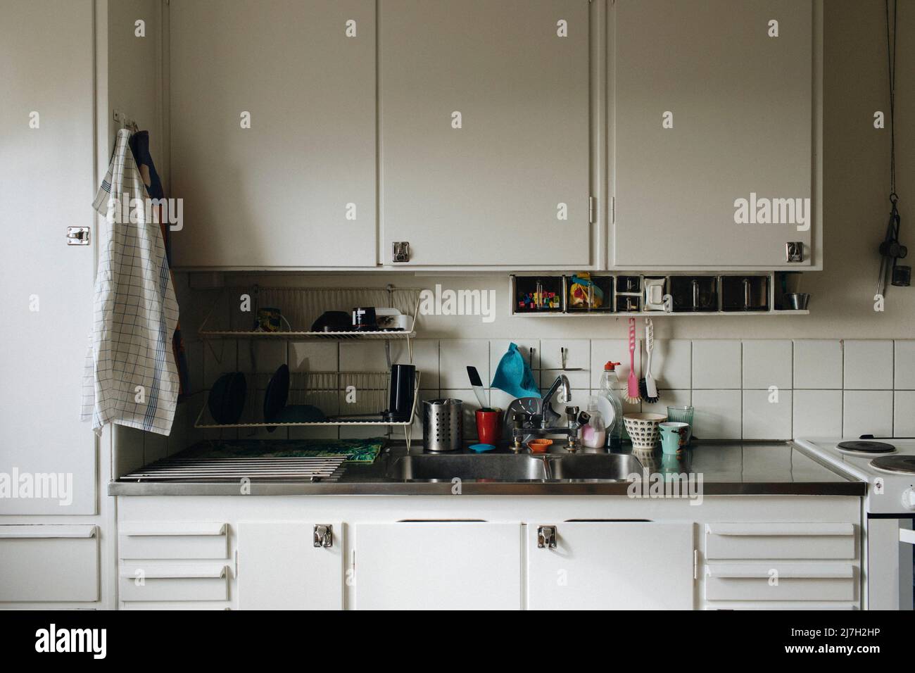 Kitchen with tidy counter and cabinets Stock Photo - Alamy