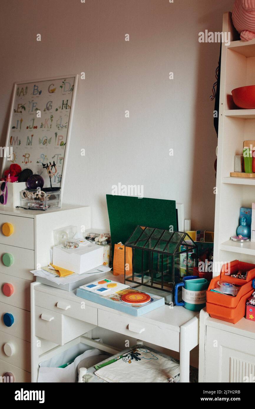 School supplies arranged on table by drawers and shelf Stock Photo - Alamy