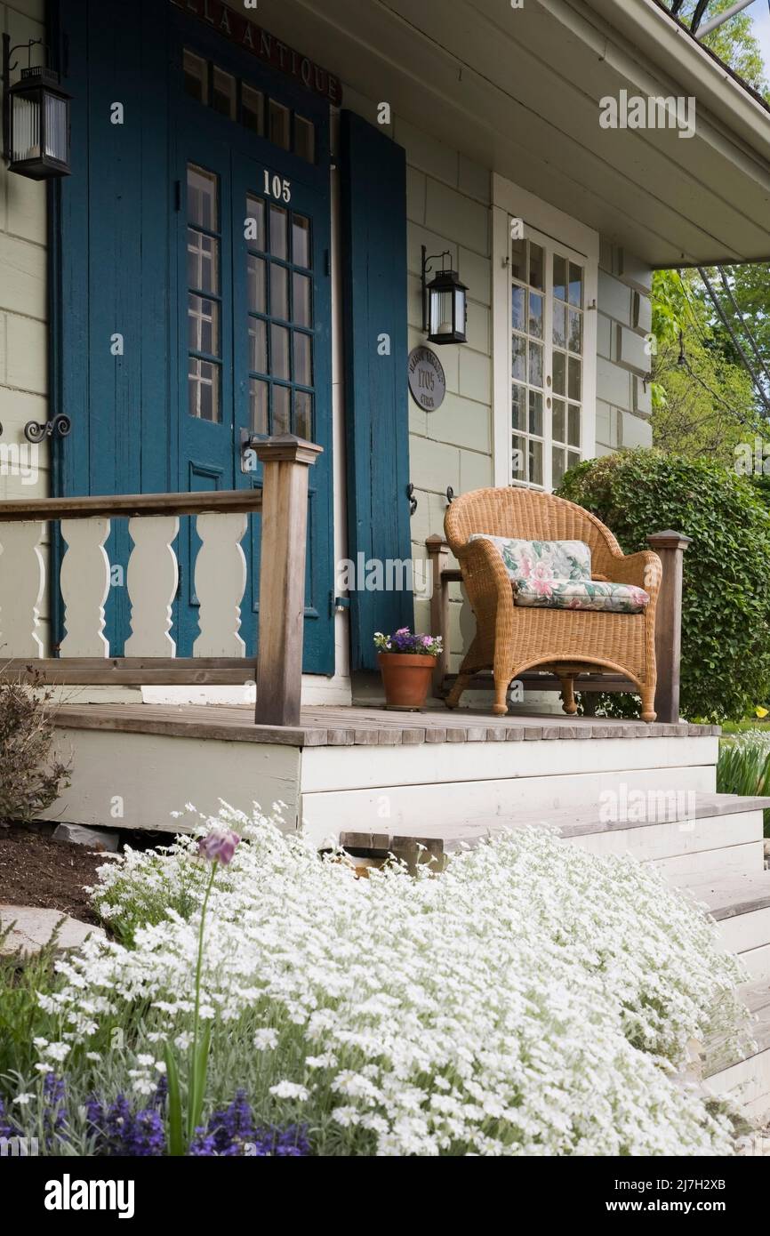 Old circa 1705 light green beveled clapboard home with white and blue ...