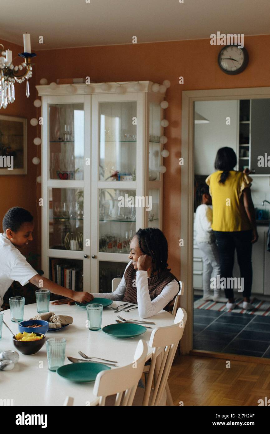 Brother sister talking home hi-res stock photography and images - Alamy