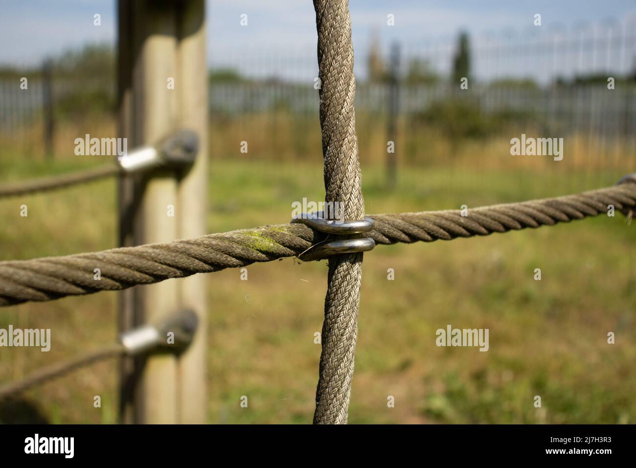 close up of rope and wire climbing equipment in a children's play park ...