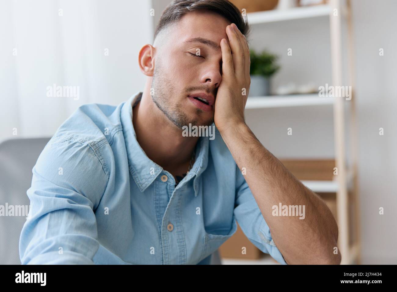 Sad depressed man closing hi-res stock photography and images - Alamy