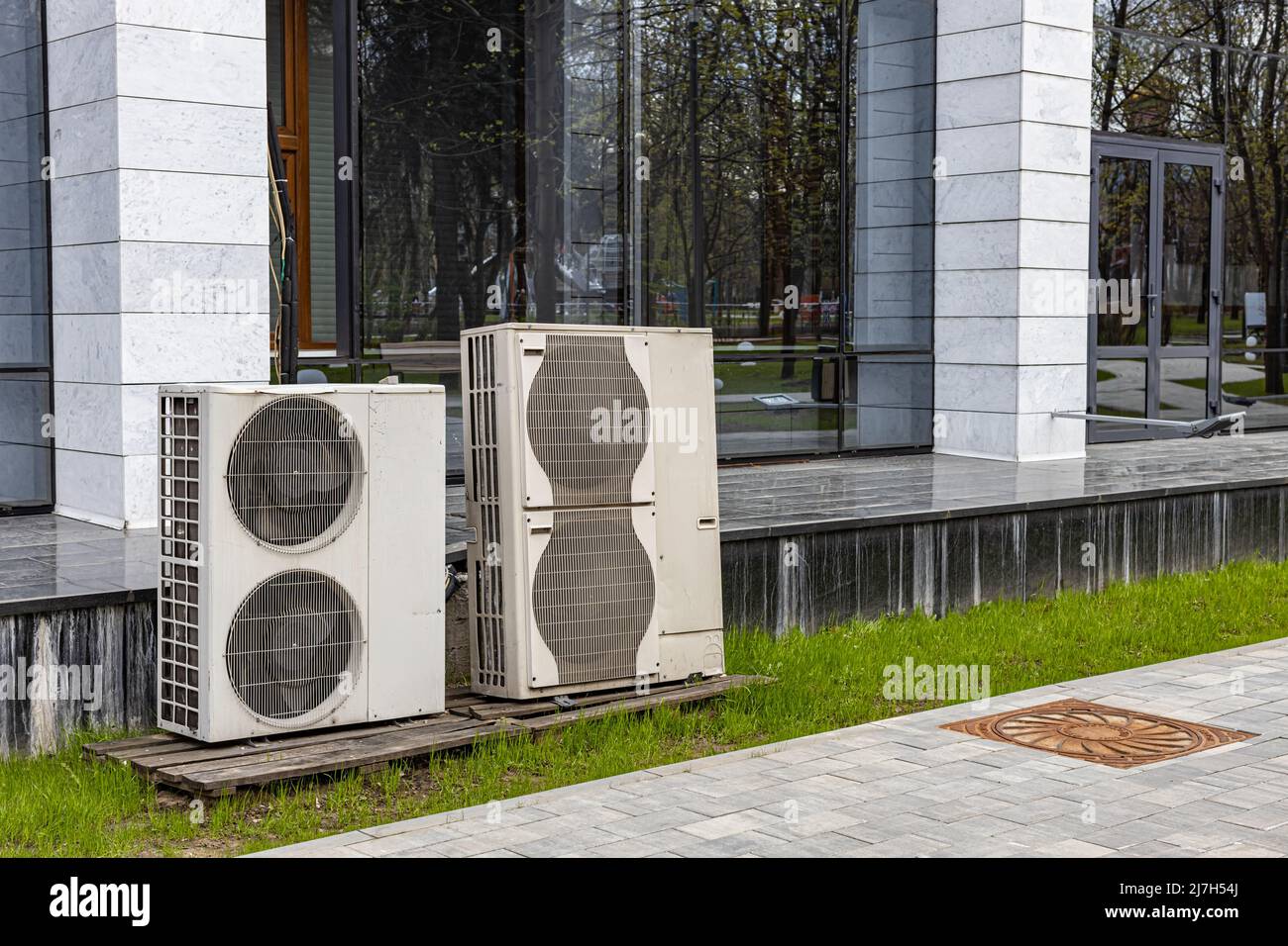 outdoor air conditioner unit installed outdoors on the ground. High ...