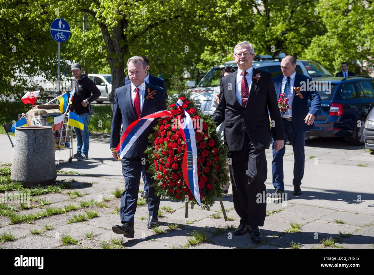 Russia's ambassador to Poland, Sergey Andreev (on the right) carries a ...