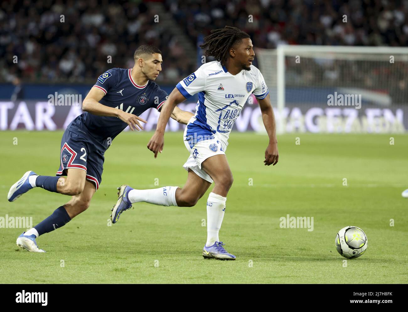 Yasser Larouci of Troyes, Achraf Hakimi of PSG (left) during the French ...