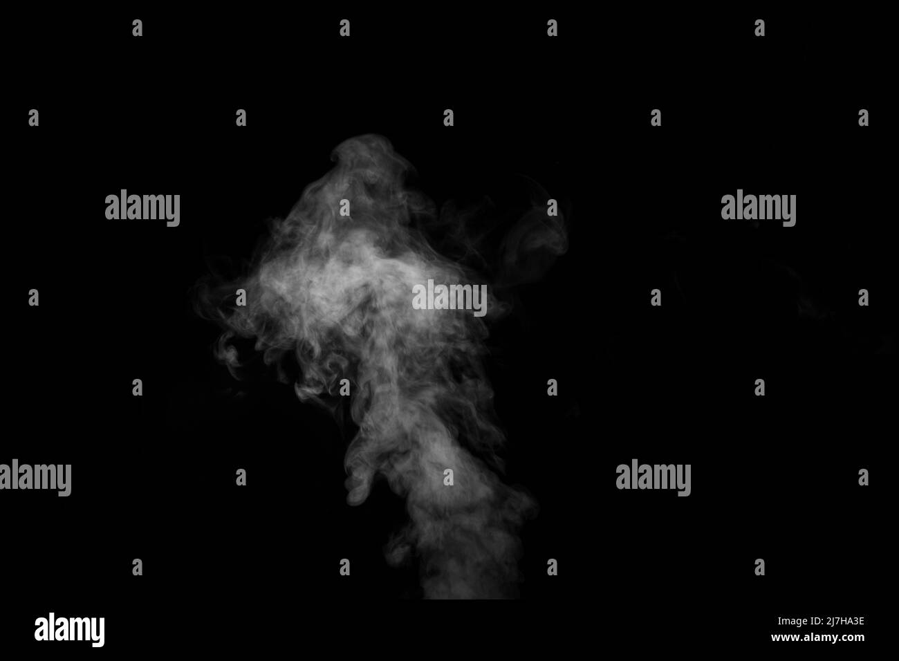 Curly white steam rising up and splashing water scattering in different ...