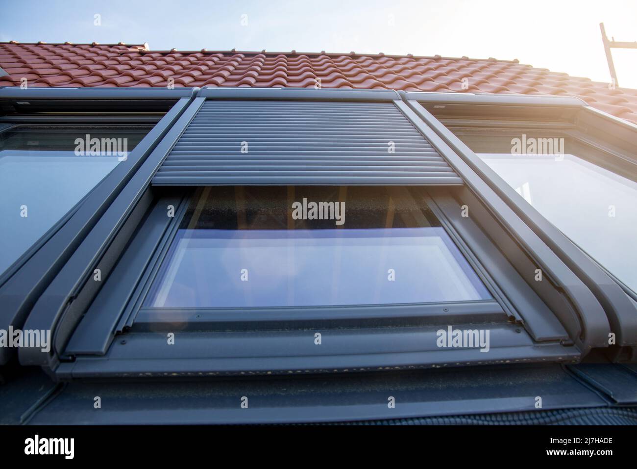Close up of new skylight with roller shutter Stock Photo - Alamy