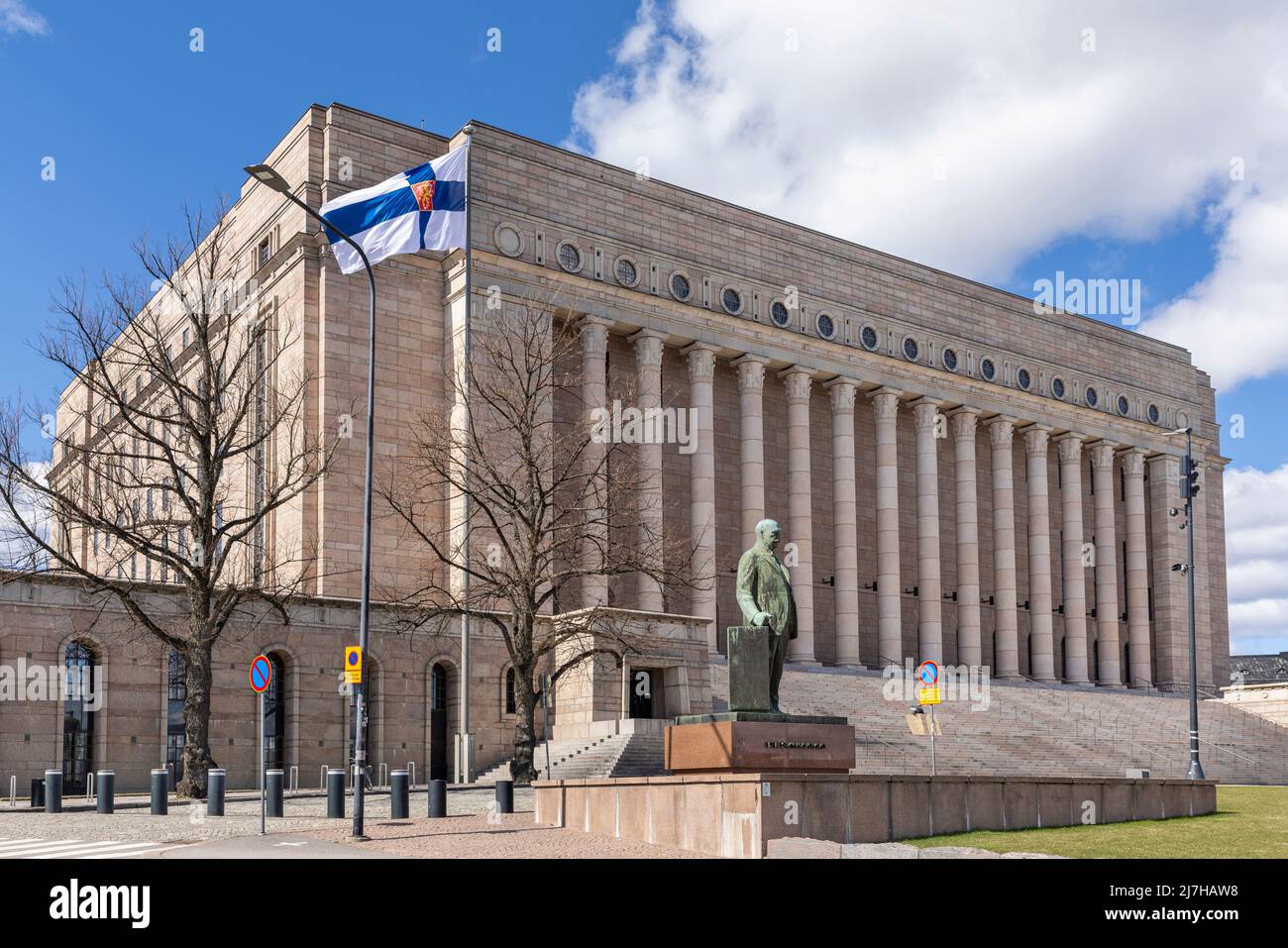 Finnish flag flying in front of Finnish parliament building in Helsinki ...