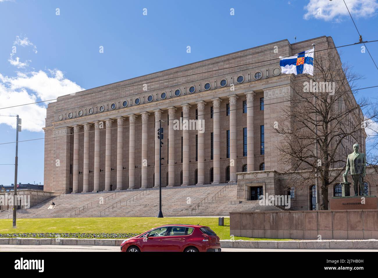 Finnish flag flying in front of Finnish parliament building in Helsinki ...