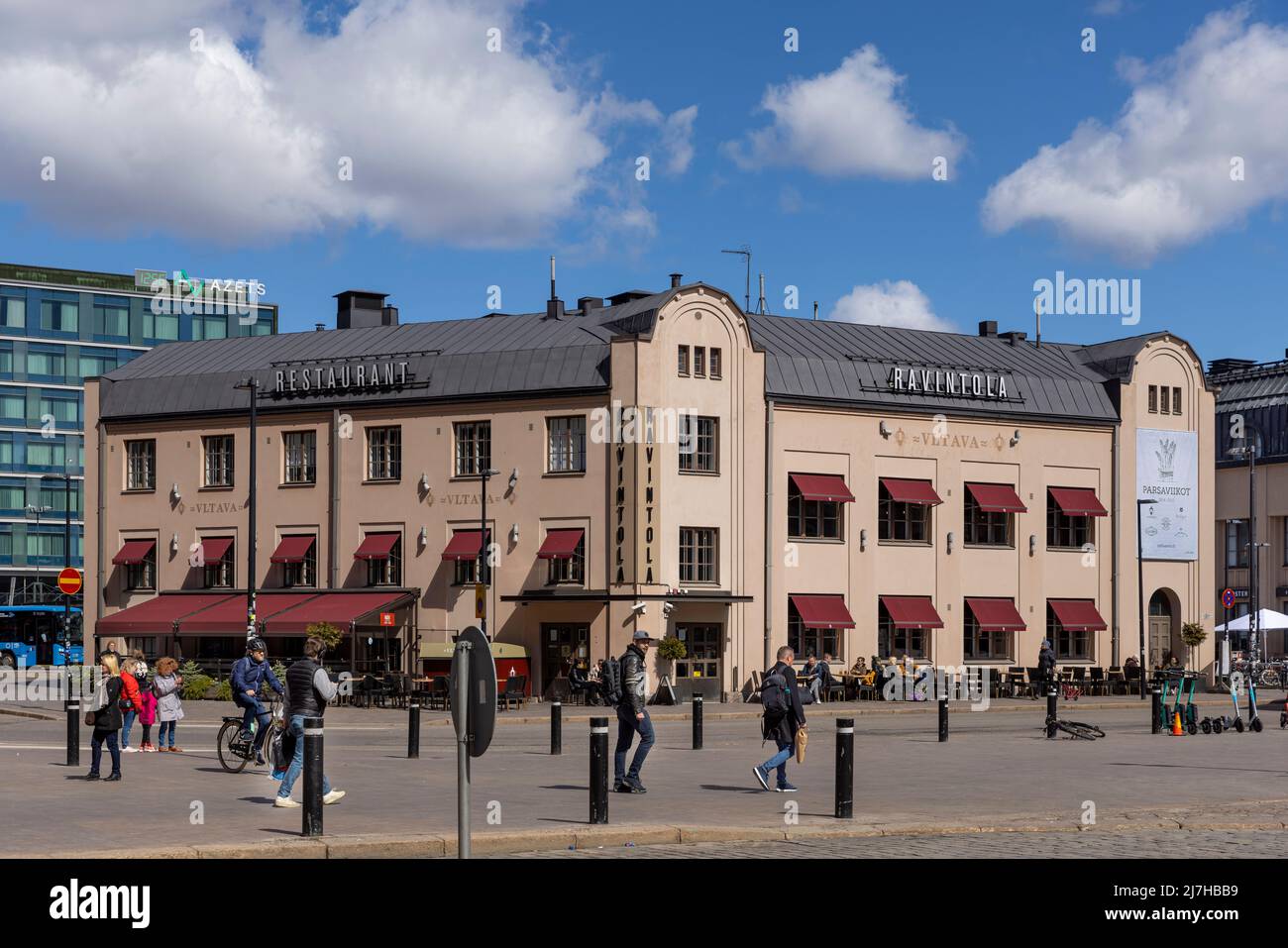 Tourists walking in front of a famous restaurant building downtown ...