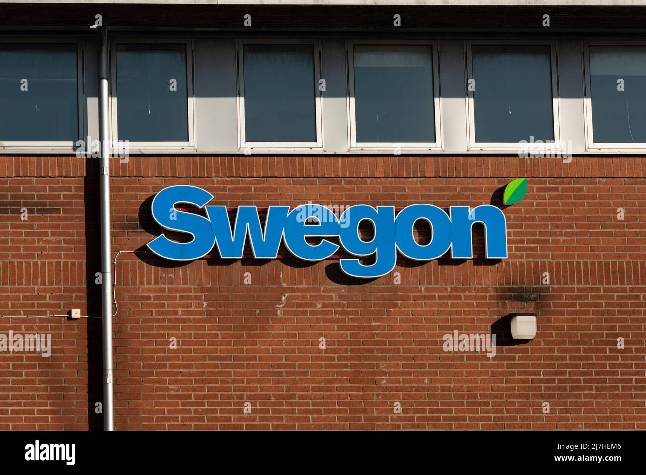 Swegon sign on the facade of a building Stock Photo - Alamy