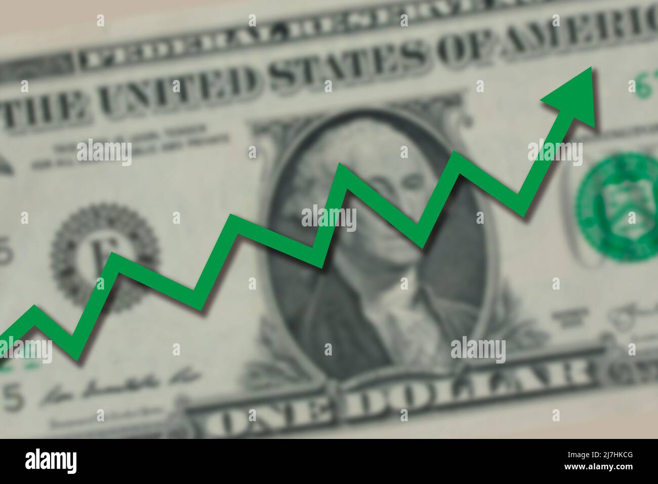 Blurred one US dollar bill with green stock market chart arrow going up ...