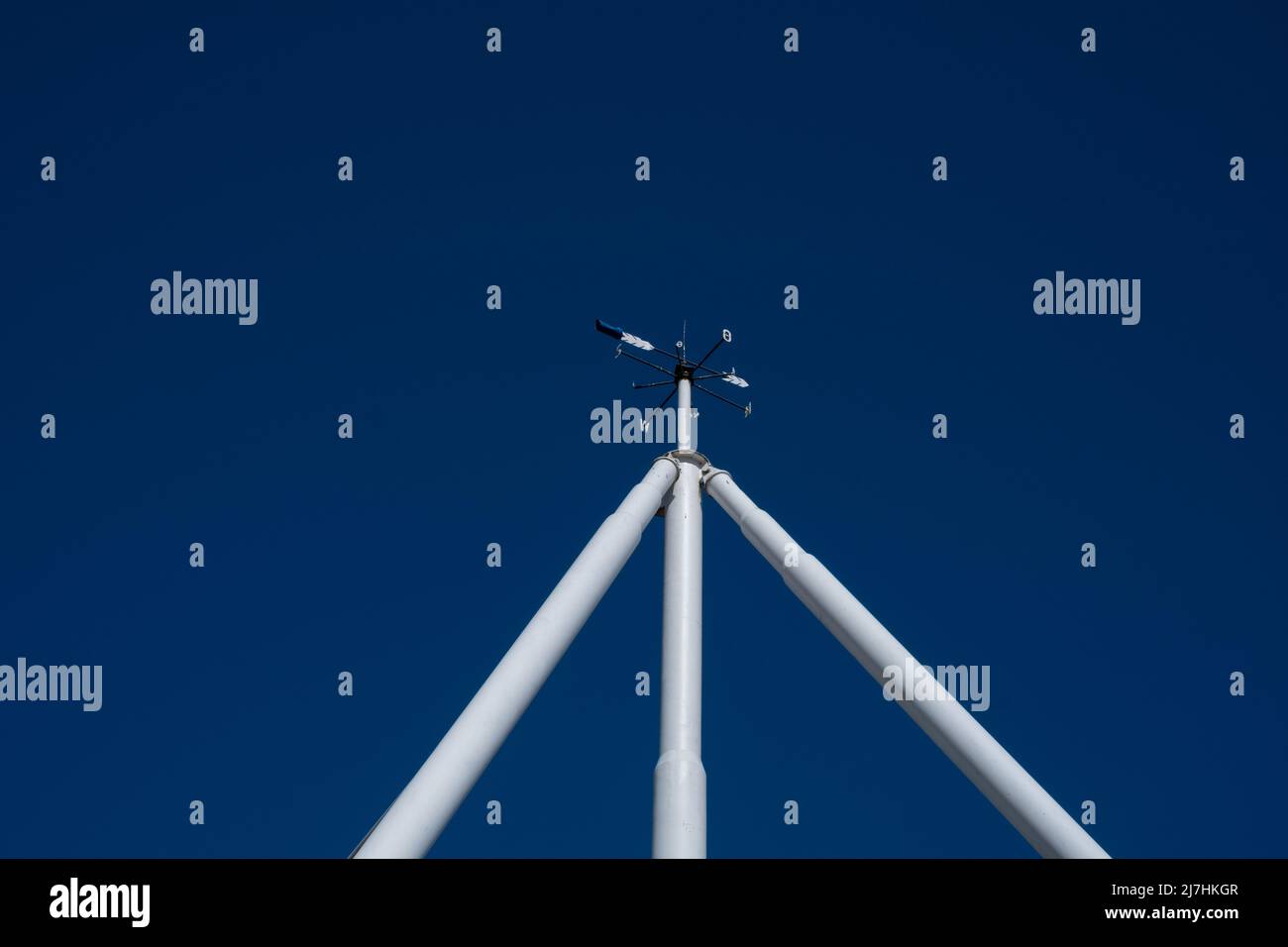 on a white mast there is a wind direction indicator Stock Photo - Alamy