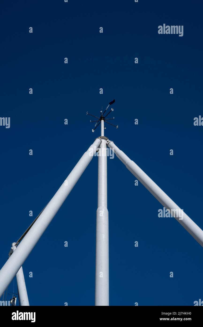 on a white mast there is a wind direction indicator Stock Photo - Alamy