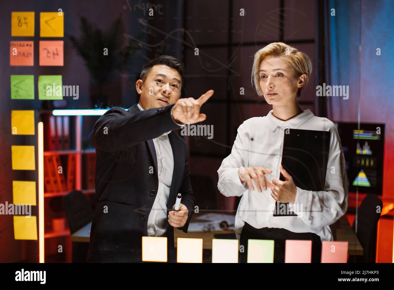 Scrum kanban glass board. Multiethnic creative two diverse business ...