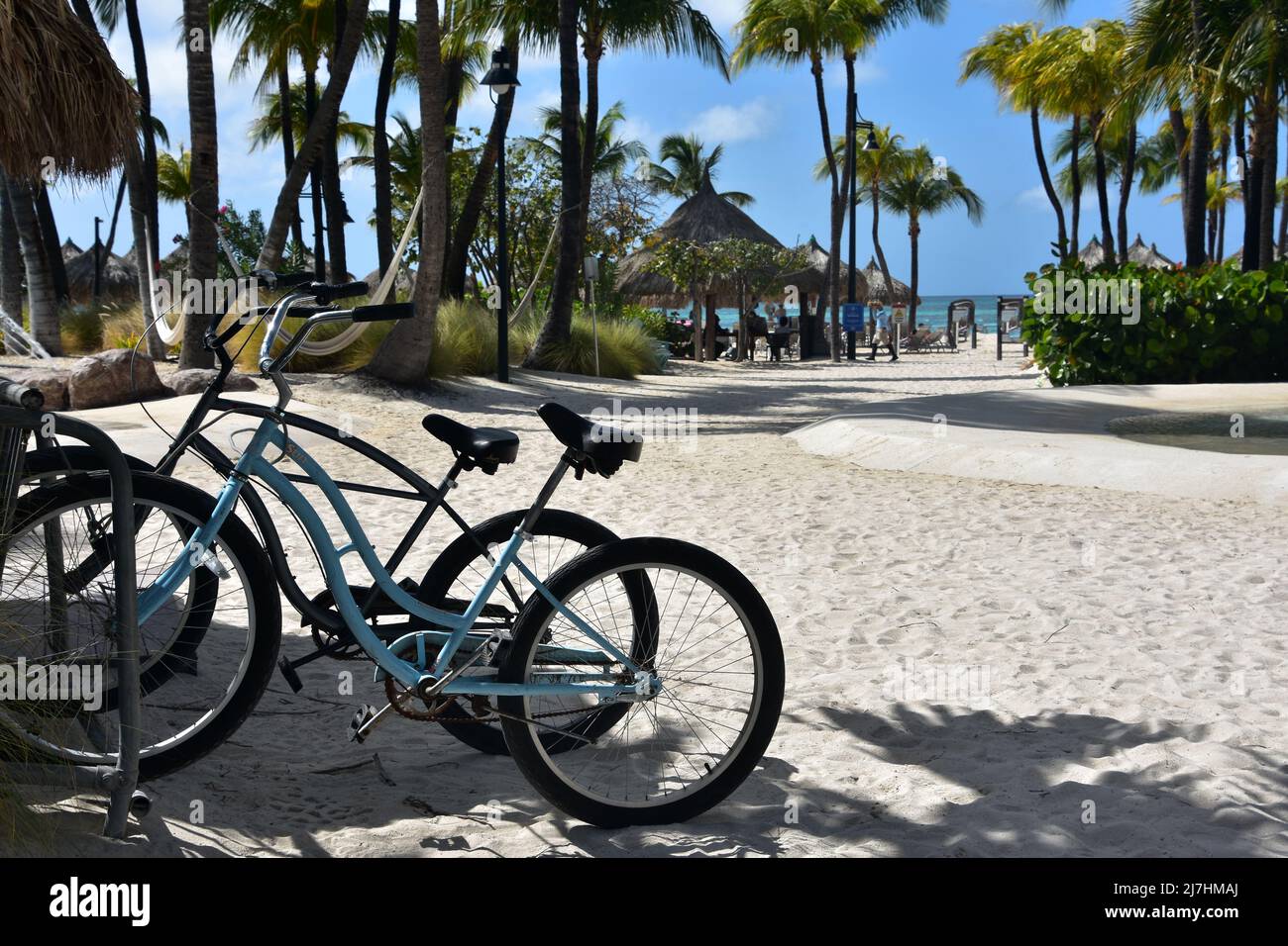 Pair of electric bikes parked on a beach in the sand Stock Photo - Alamy