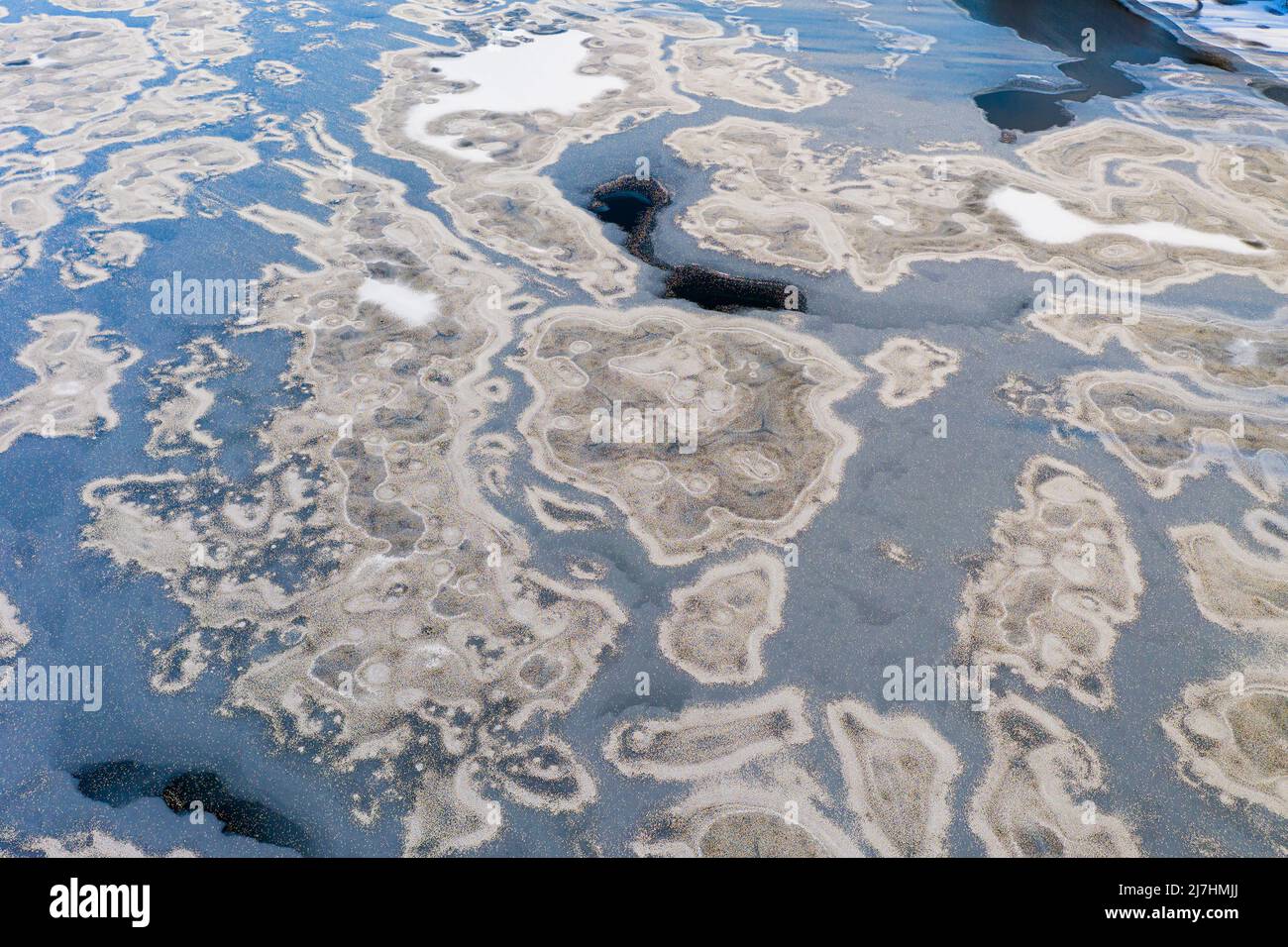 Top view of frozen ice on the river. River in ice. Beautiful snow and ...